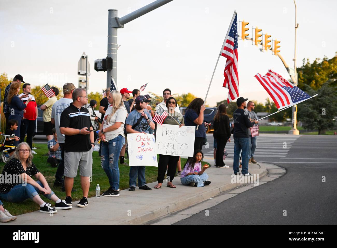 People outside at Timpanogos Regional Hospital await the transport of ...