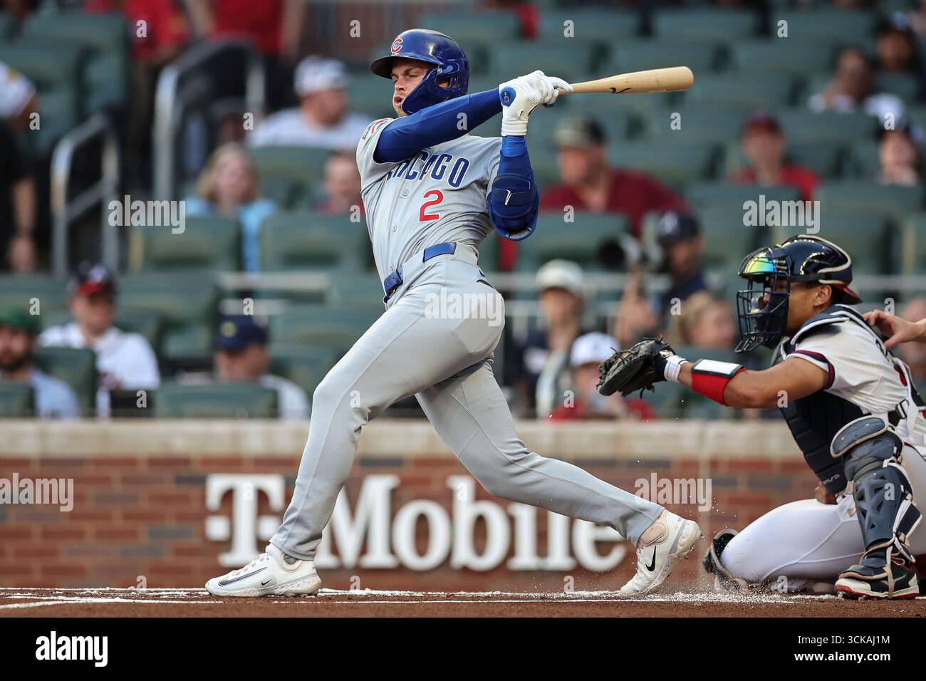 Chicago Cubs' Nico Hoerner (2) hits a single in the first inning of a ...