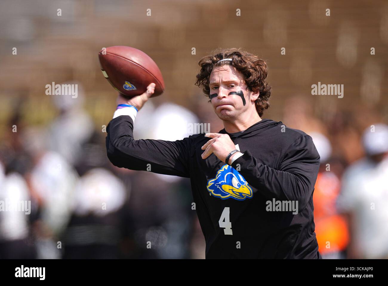 Delaware quarterback Nick Minicucci (4) warms up before an NCAA college ...
