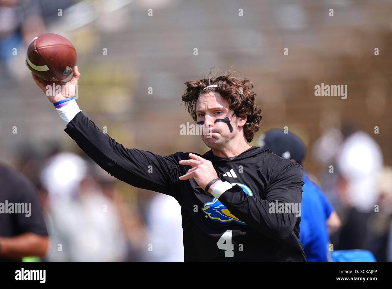 Delaware quarterback Nick Minicucci (4) warms up before an NCAA college ...