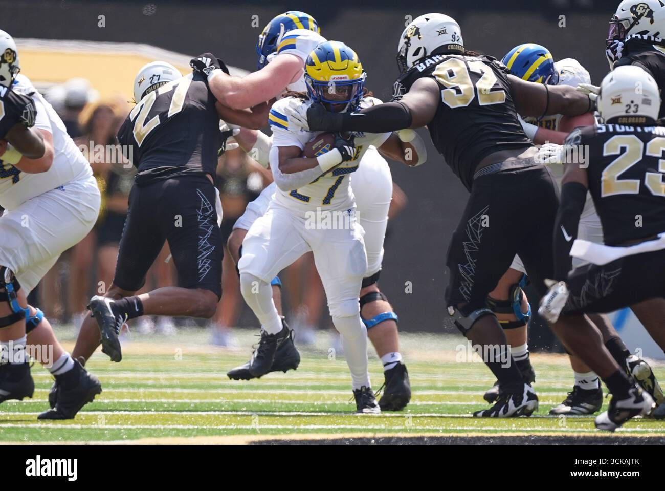 Colorado defensive tackle Anquin Barnes Jr. (92) stops Delaware running ...