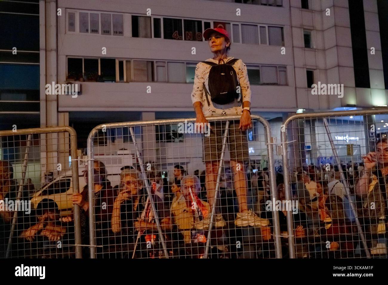 A woman watches the rally. The 53rd rally in the series of rallies ...