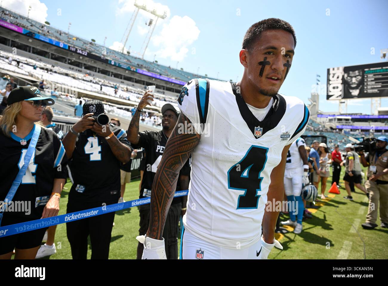 Carolina Panthers wide receiver Tetairoa McMillan (4) leaves the field after warming up before ...