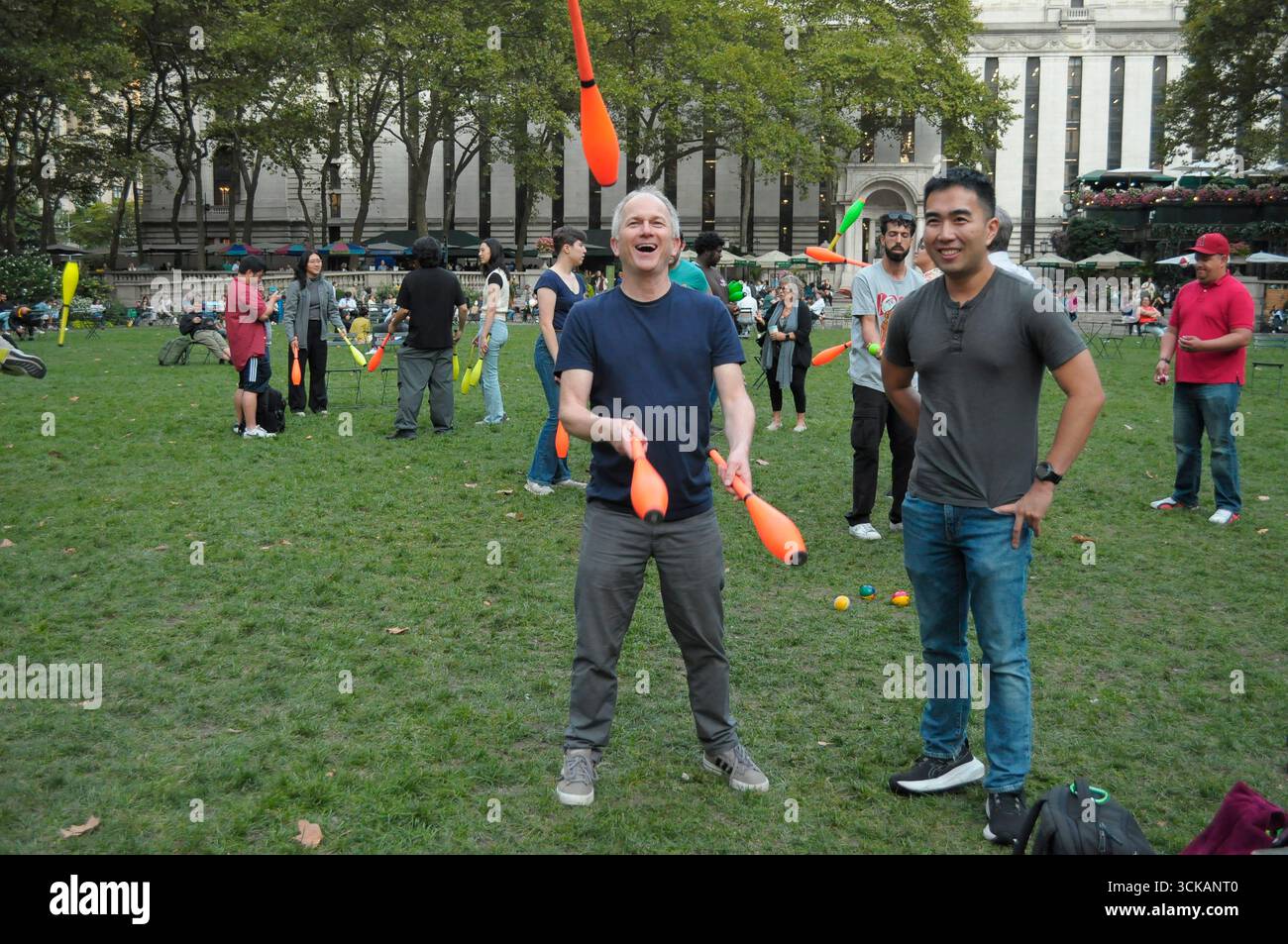 People practice juggling in Bryant Park. (Photo by Jimin Kim / SOPA ...