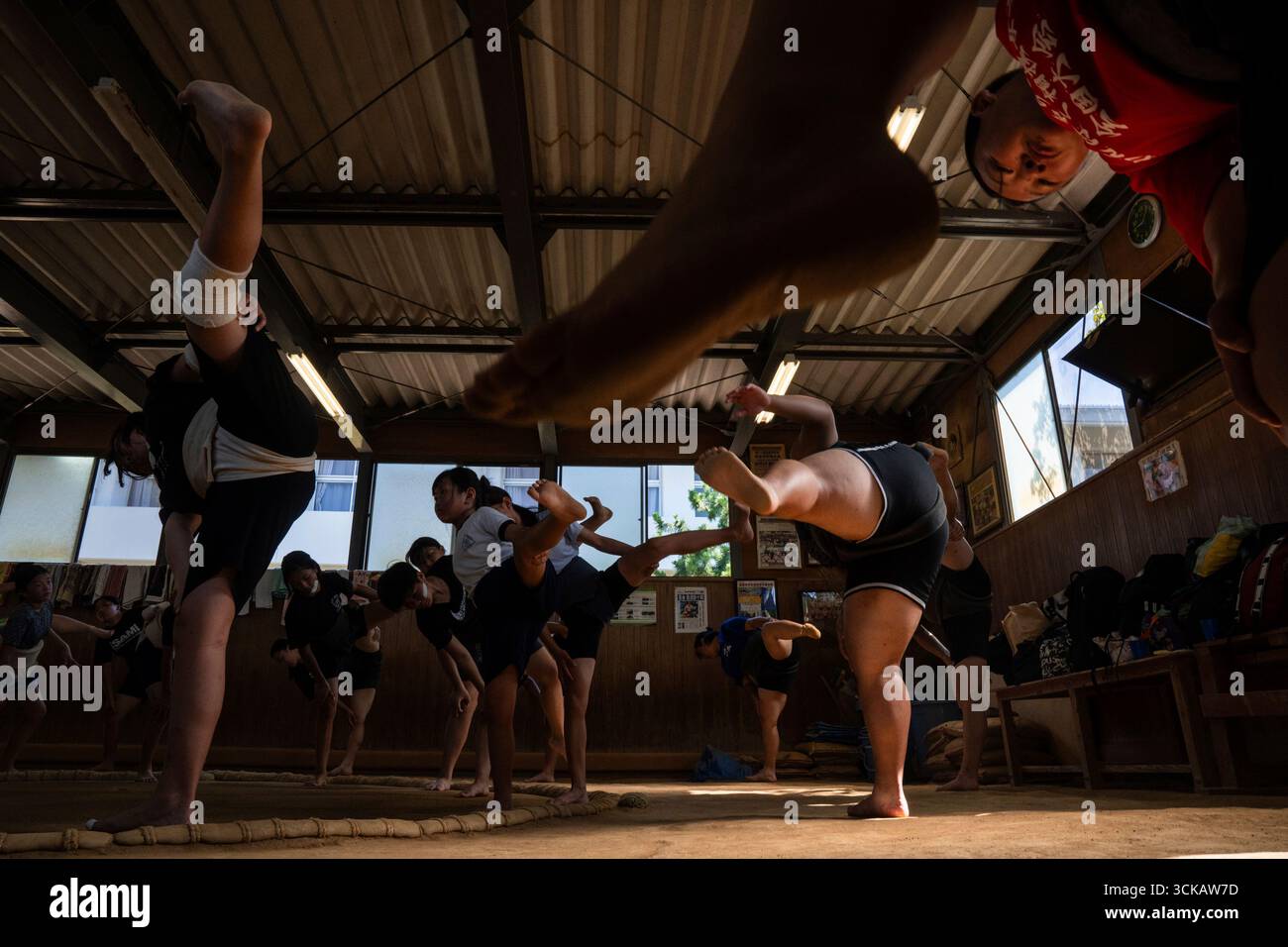 Wrestlers train during a practice session at a sumo camp in Tottori ...