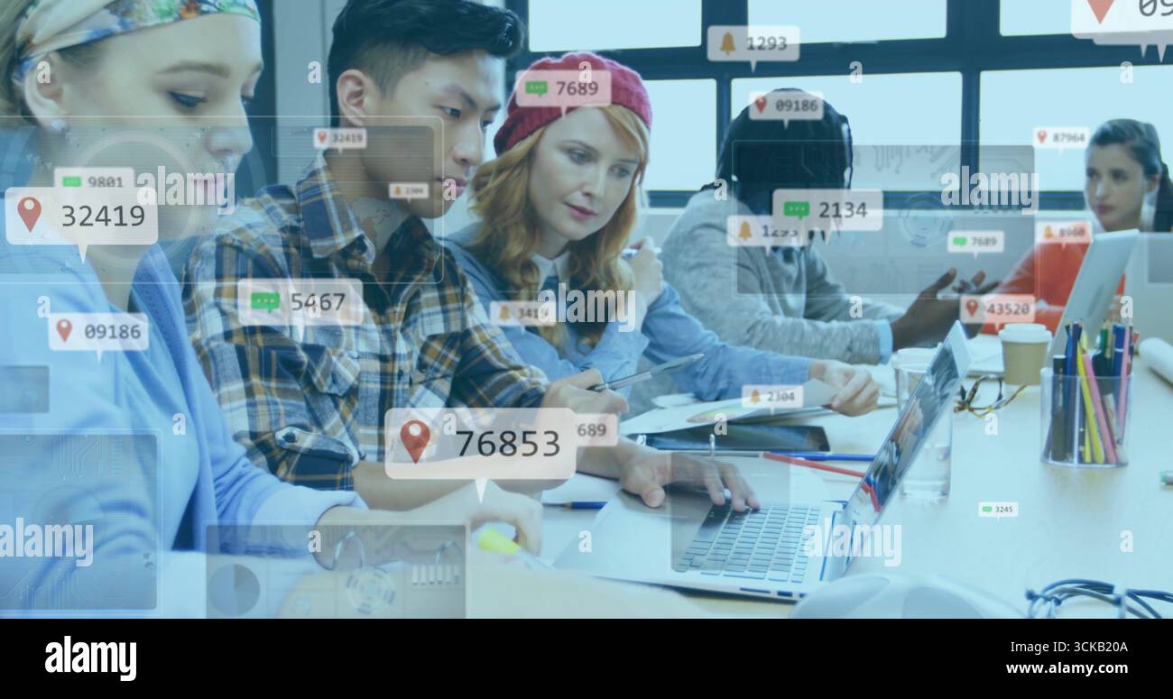 Collaborating team of five analyzing data on laptops in office, with ...