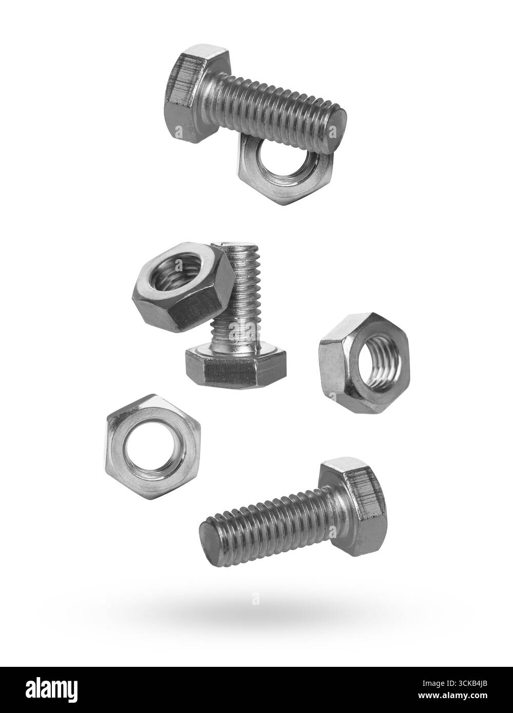 Metal nuts and bolts falling against white background Stock Photo - Alamy