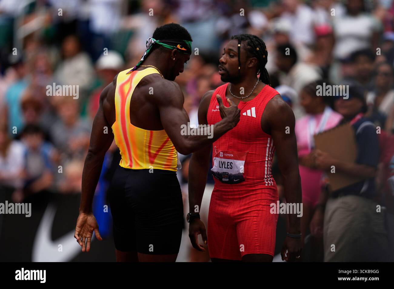 FILE - Noah Lyles and Kenny Bednarek talk after the men's 200-meter ...