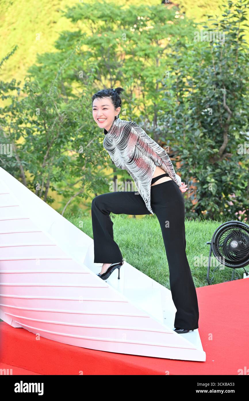 Taiwanese singer and actress Amber Kuo attends an activity in Beijing ...