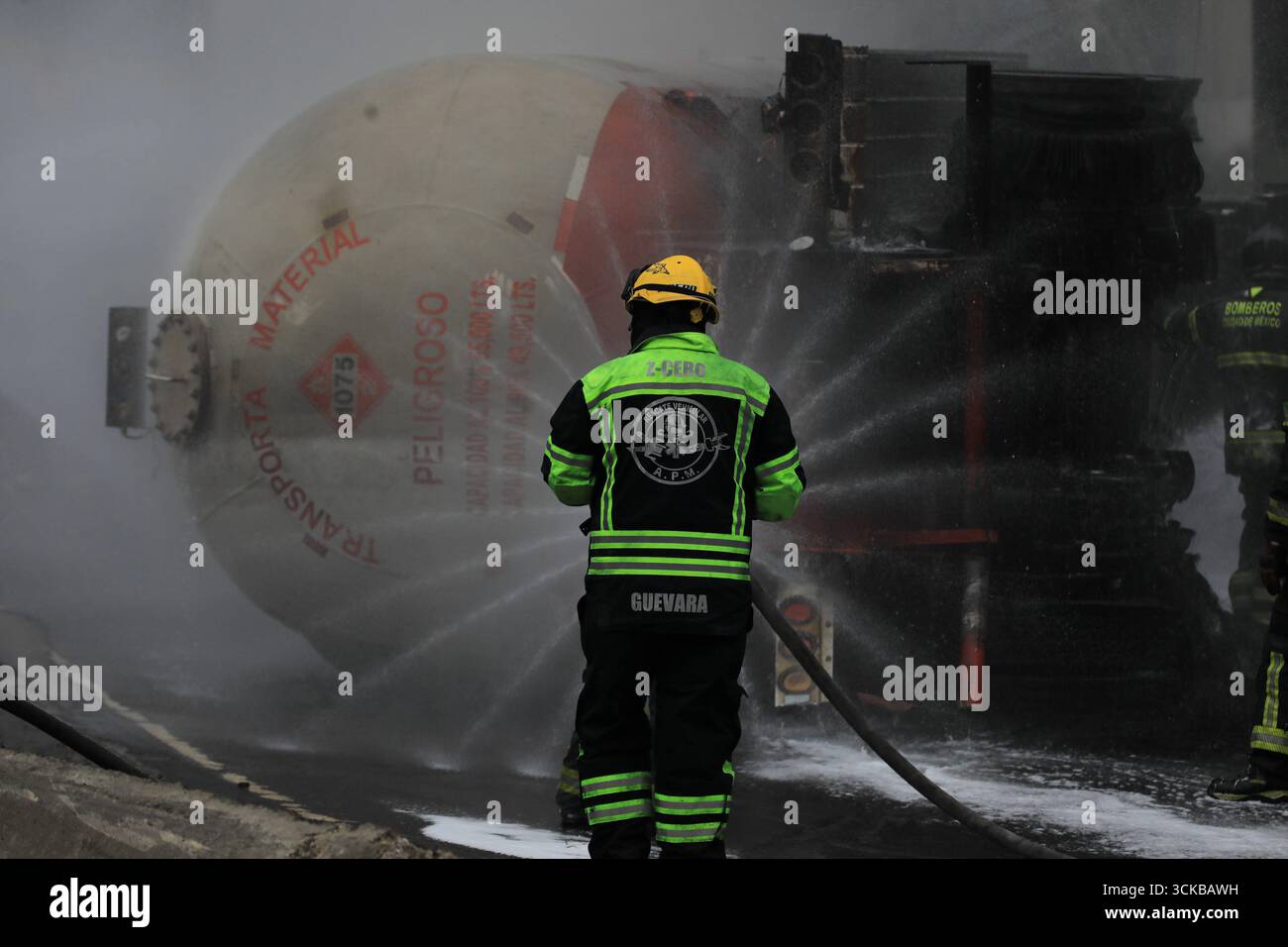 Gas Tanker Explosion Leaves 57 People Injured A Firefighter puts out ...