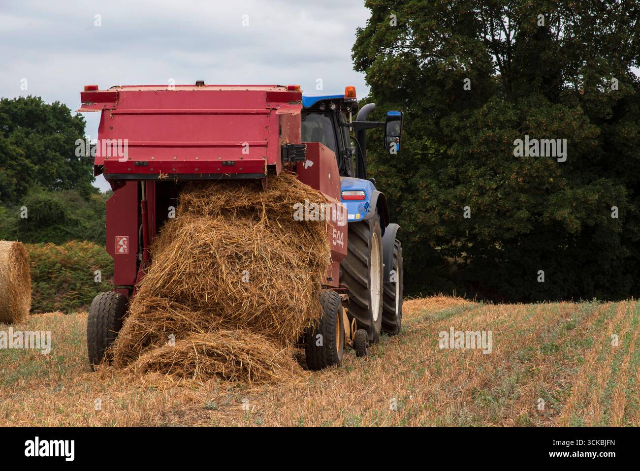 Farmer harvesting hay baler hi-res stock photography and images - Alamy