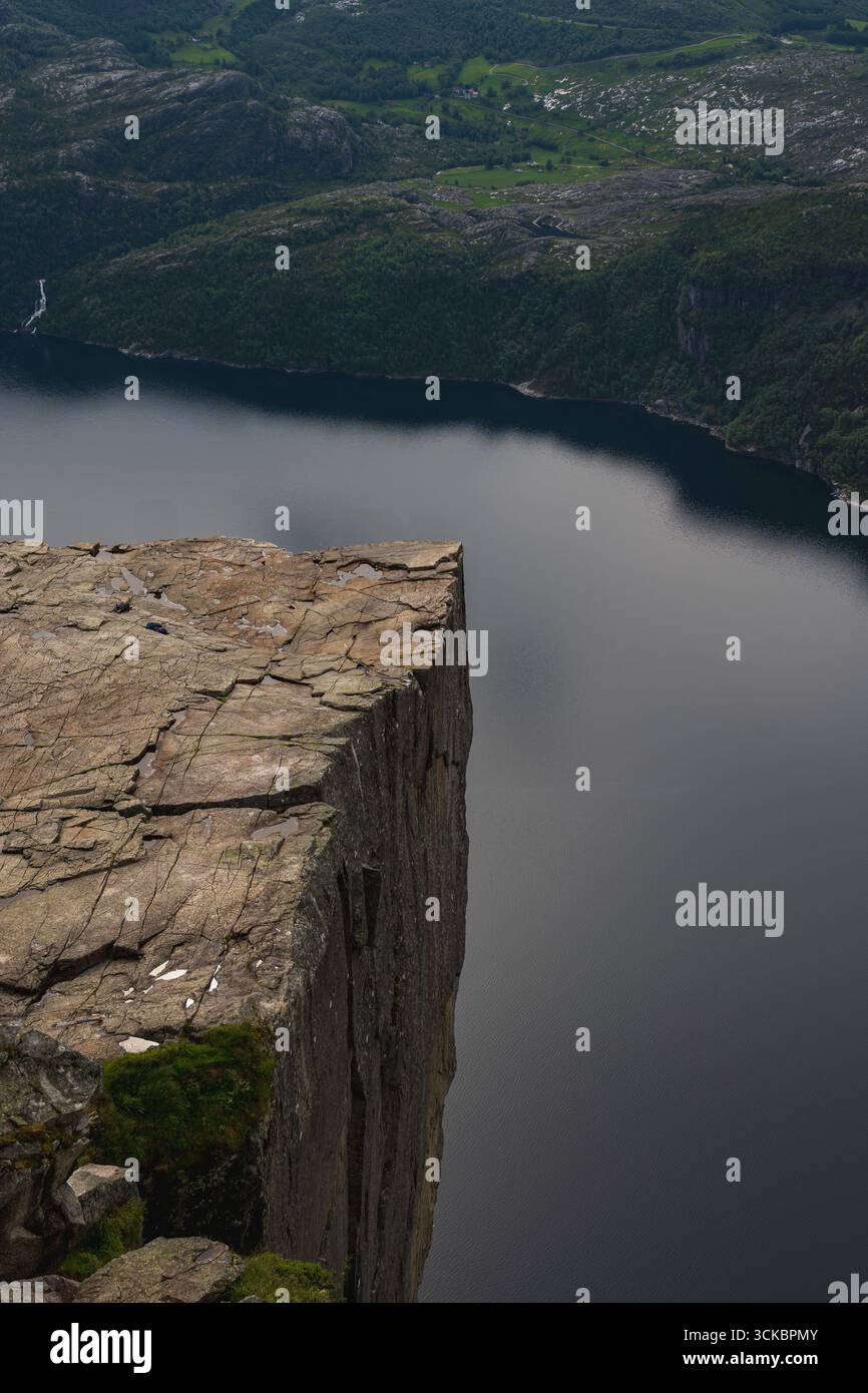 Preikestolen, a flat topped cliff in Norway, towers above Lysefjord ...