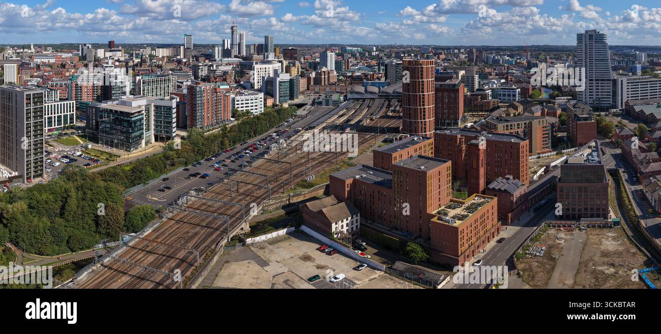 Panoramic aerial view of Leeds City Station with railway tracks, modern ...
