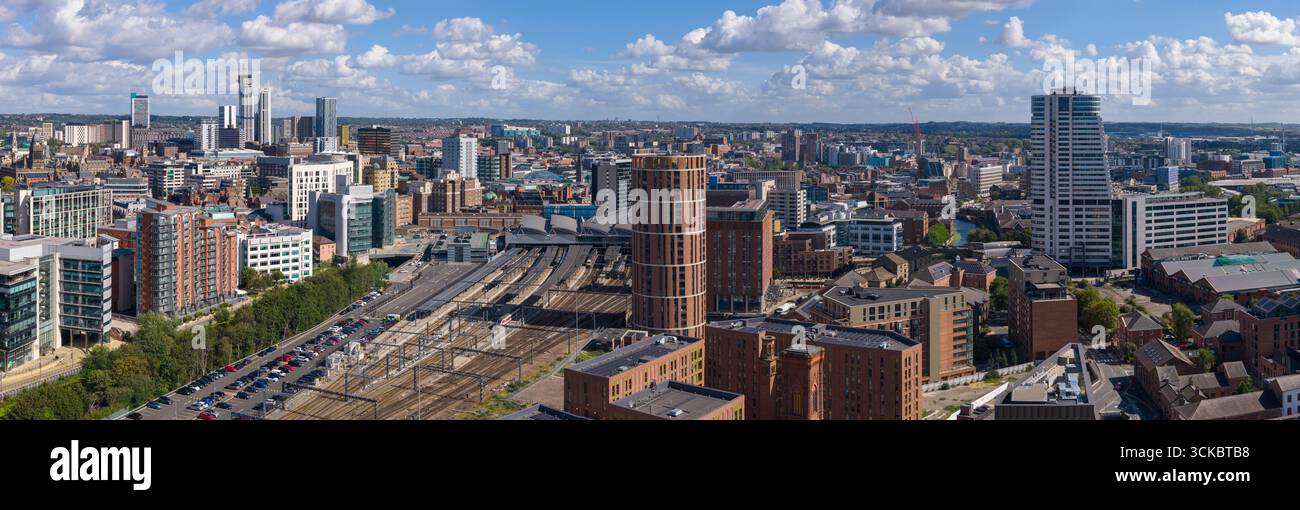 Panoramic aerial view of Leeds City Station with railway tracks, modern ...