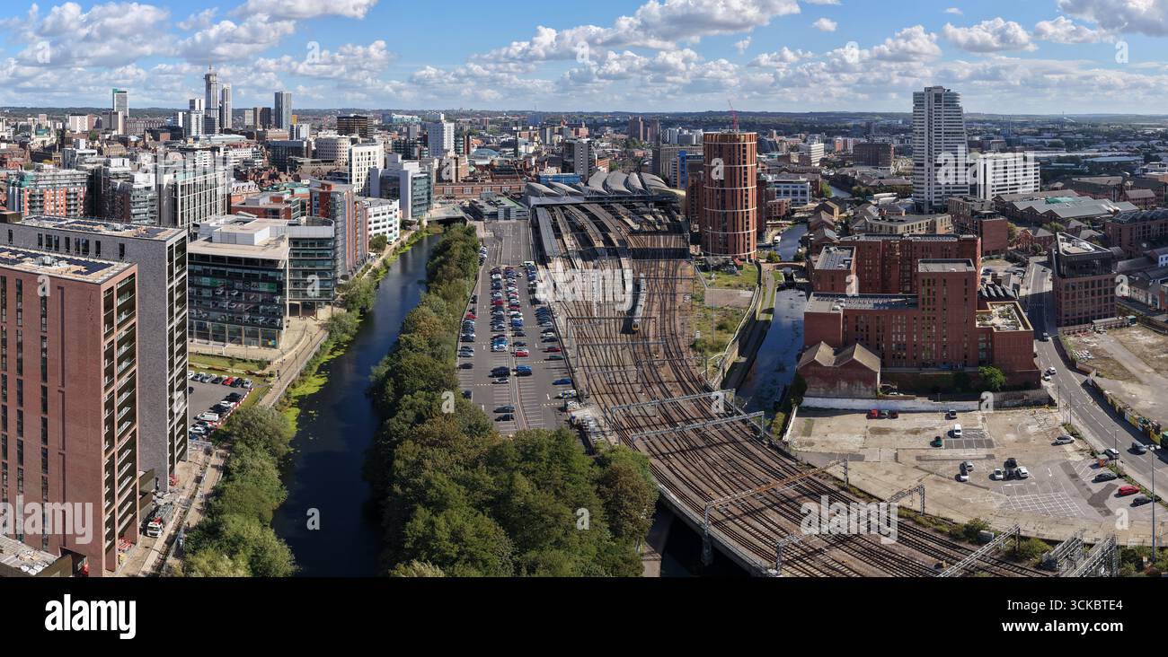 Panoramic aerial view of Leeds City Station with railway tracks, modern ...