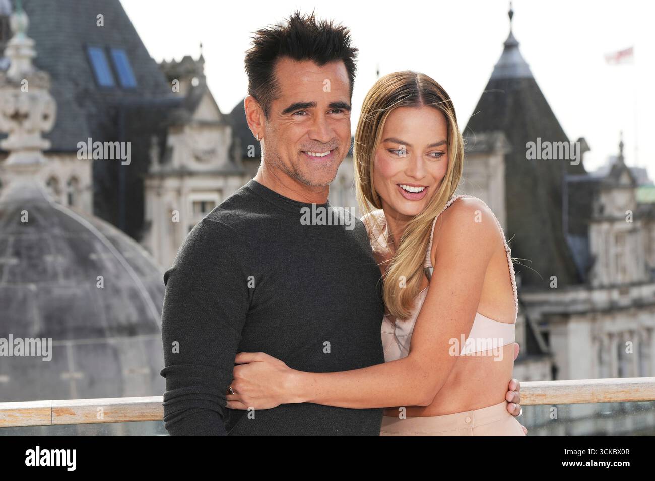 Colin Farrell , left, and Margot Robbie pose for photographers at the ...