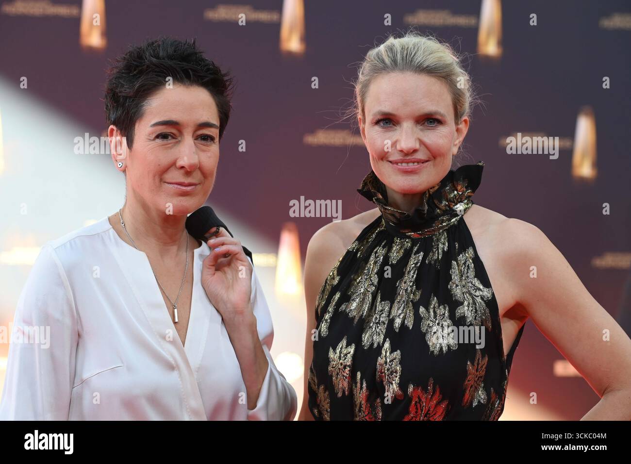 left to right Dunja HAYALI, presenter Sarah TACKE, presenter, red ...