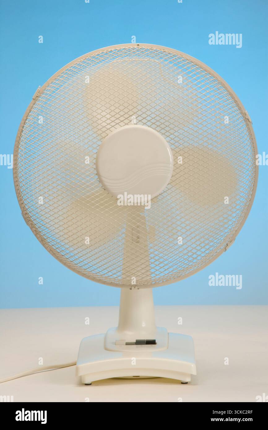 White desk fan studio still life Stock Photo - Alamy