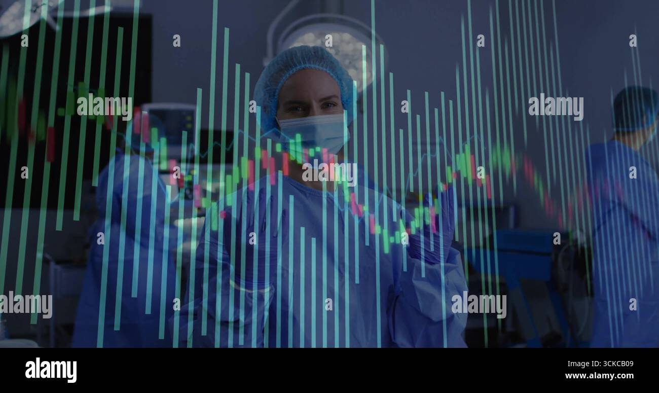 Reviewing chart overlay, lead surgeon in blue scrubs in operating room ...