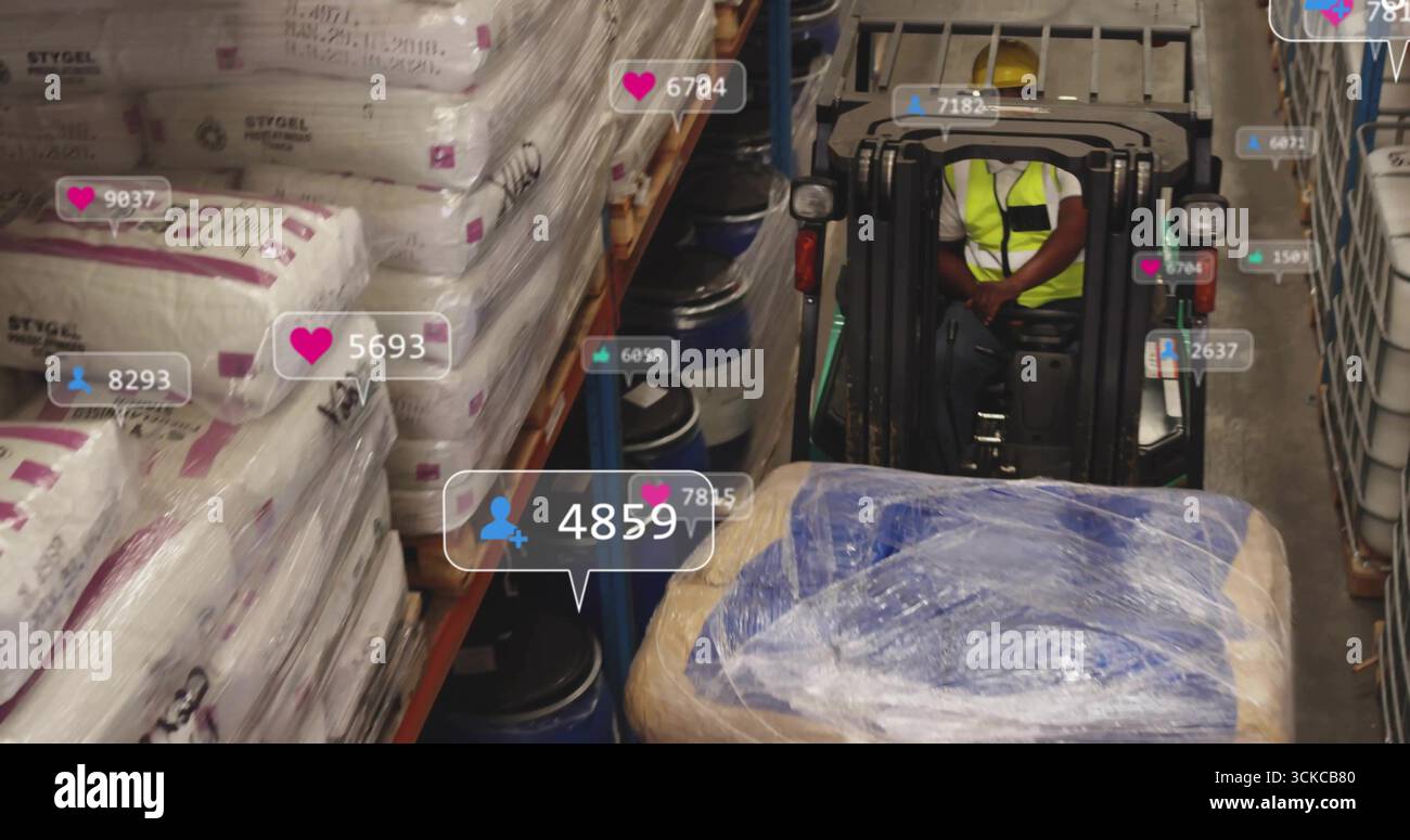 Operator wearing safety vest moving pallet on forklift in warehouse ...
