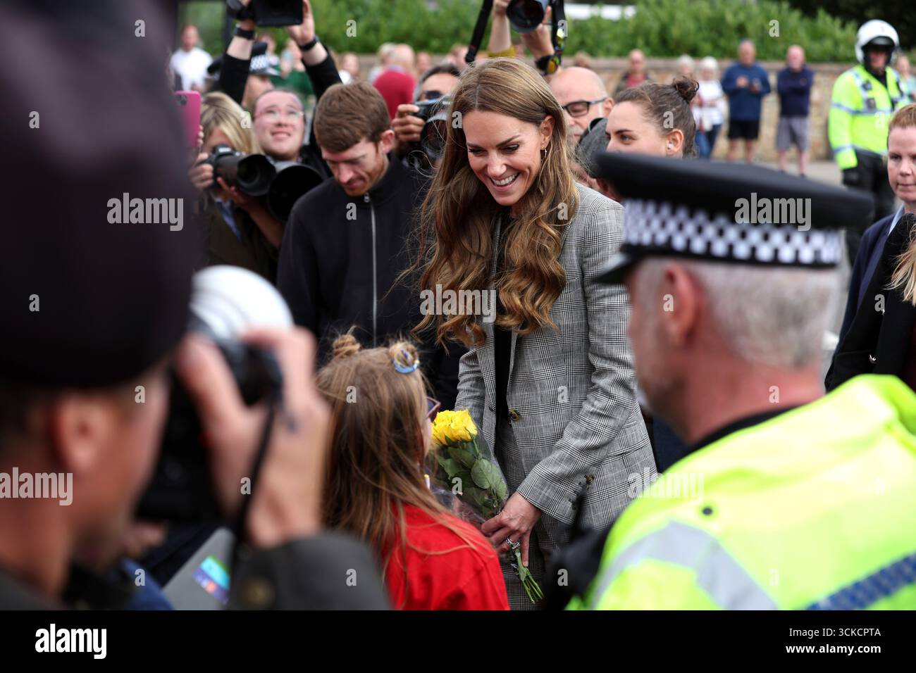 Britain's Kate, the Princess of Wales smiles as she meets well-wishers ...