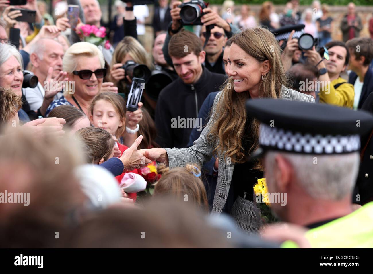 Britain's Kate, the Princess of Wales smiles as she meets well-wishers ...