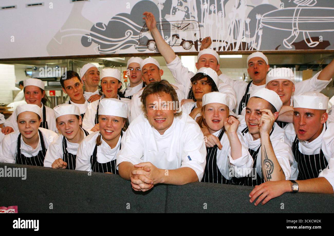 Jamie Oliver with his new trainee chefs at the opening of his new ...