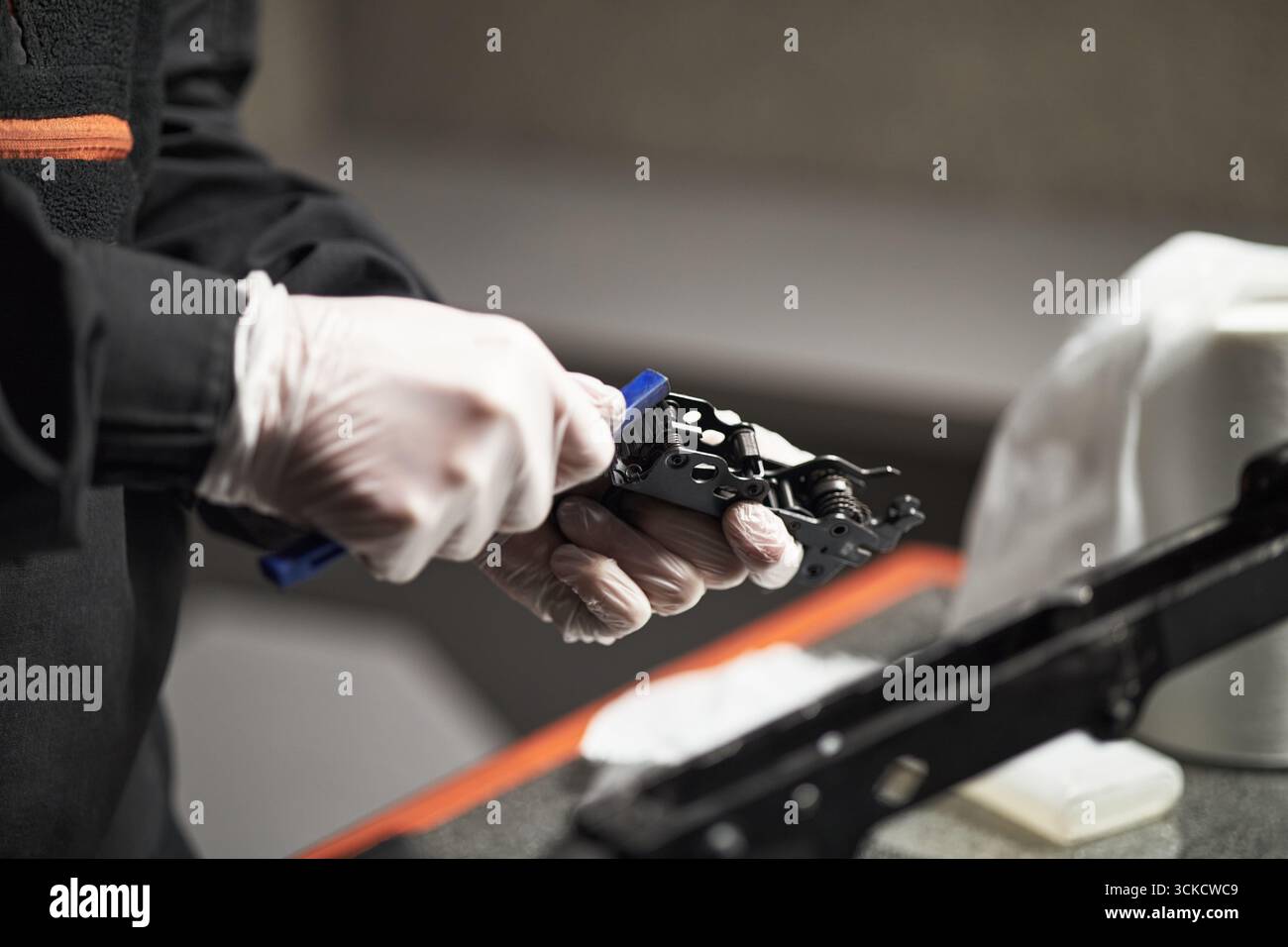 Caucasian middle aged man wearing gloves using tool to adjust ...