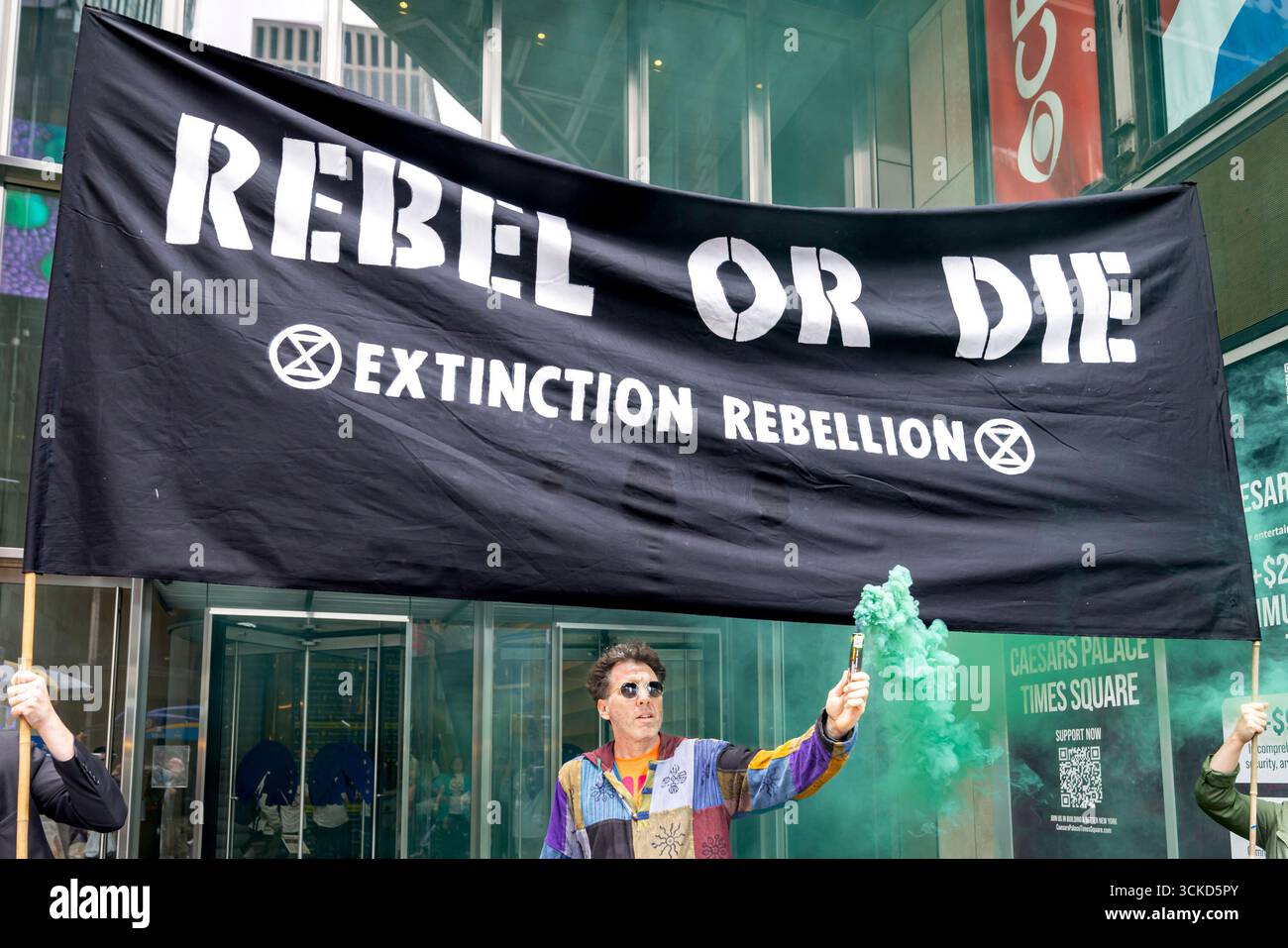 Climate activists with Extinction Rebellion block escalators inside CBS ...