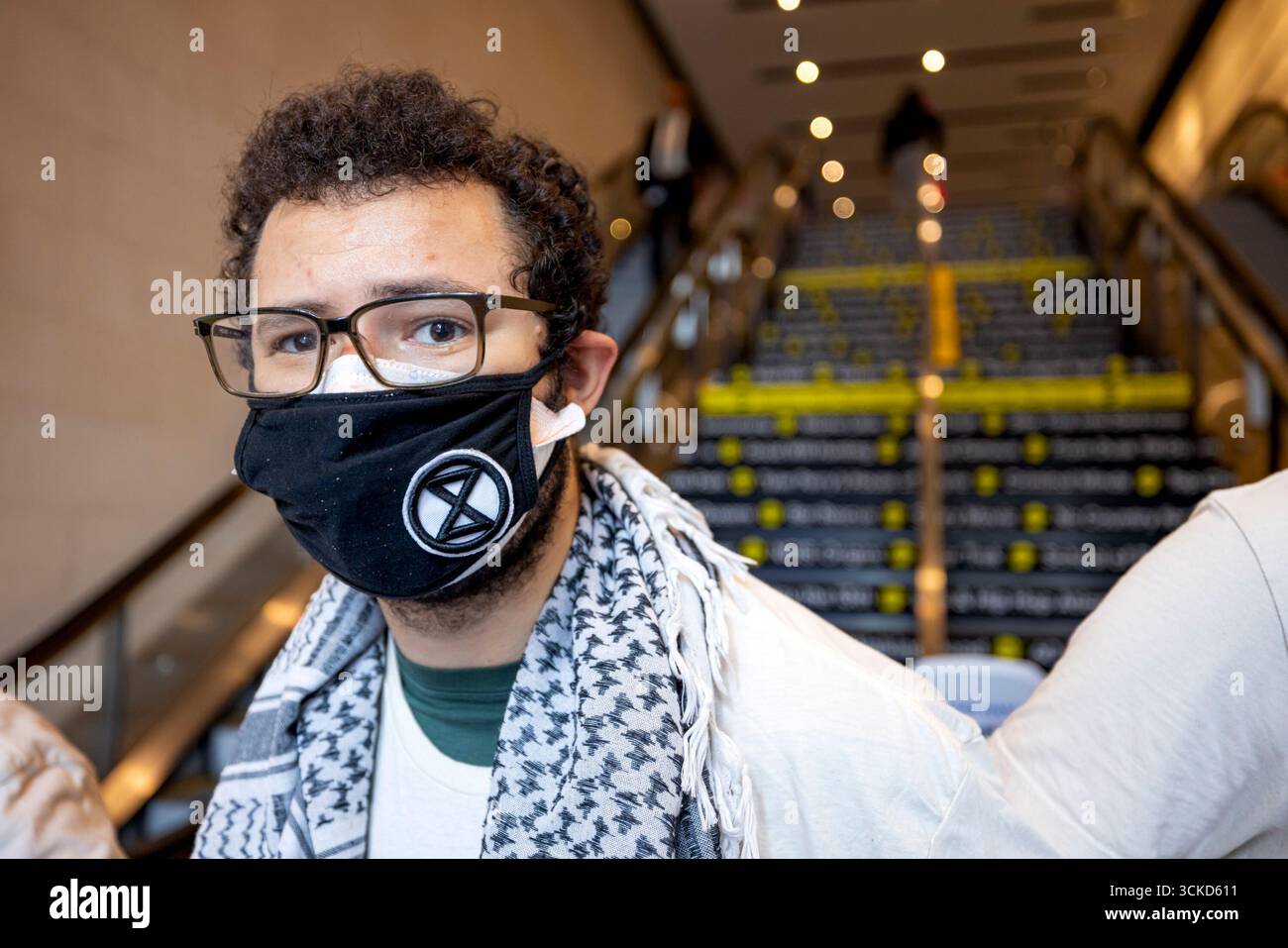 Climate activists with Extinction Rebellion block escalators inside CBS ...