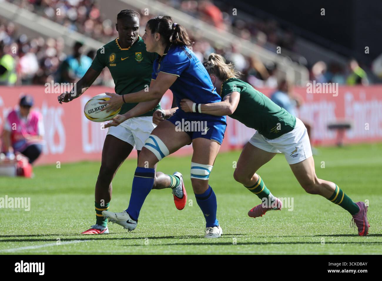 Beatrice Veronese of Italy offloads the ball under pressure from South ...