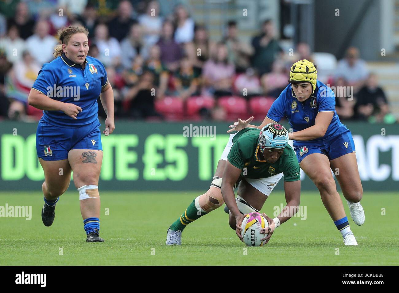 Nolusindiso Booi of South Africa goes to ground under pressure from ...