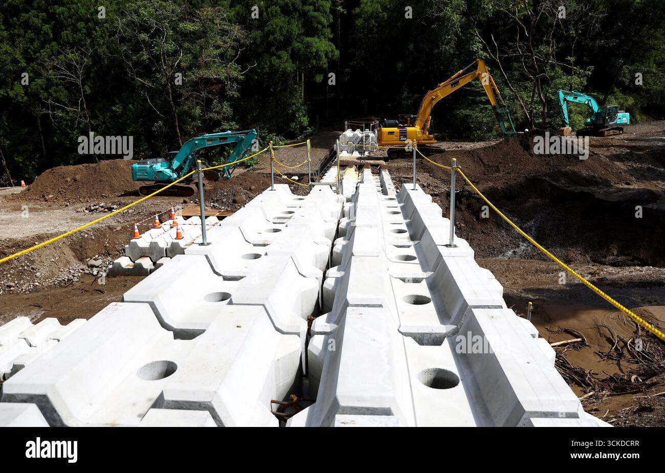 A photo shows a temporary dam installed in July upstream of the Tsukada ...