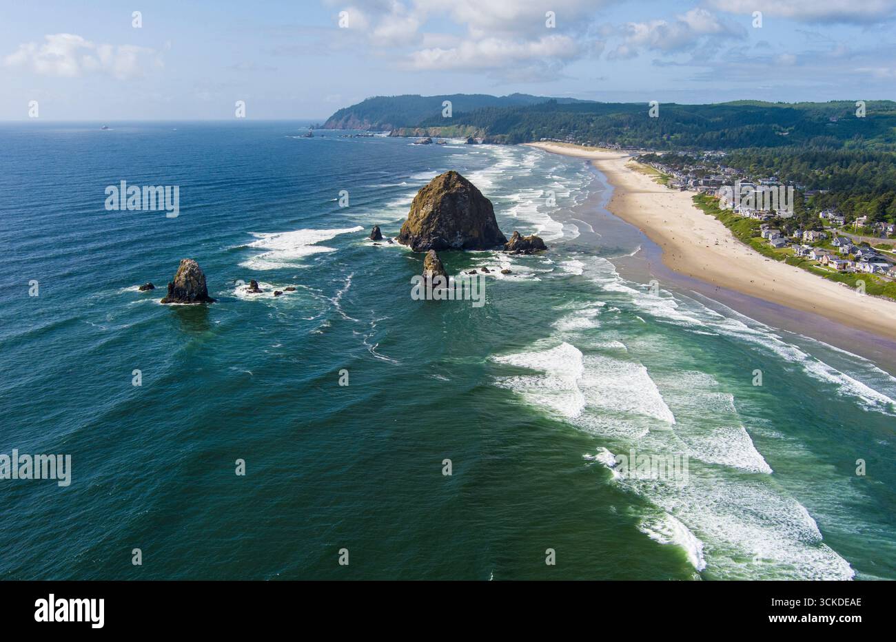 Aerial view of waves crashing on Haystack Rock along the Oregon coast ...