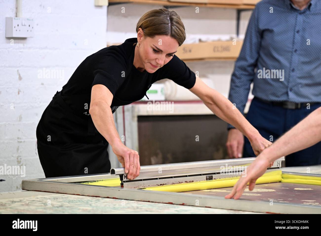 Britain's Kate, Princess of Wales, creates a screen print during a ...