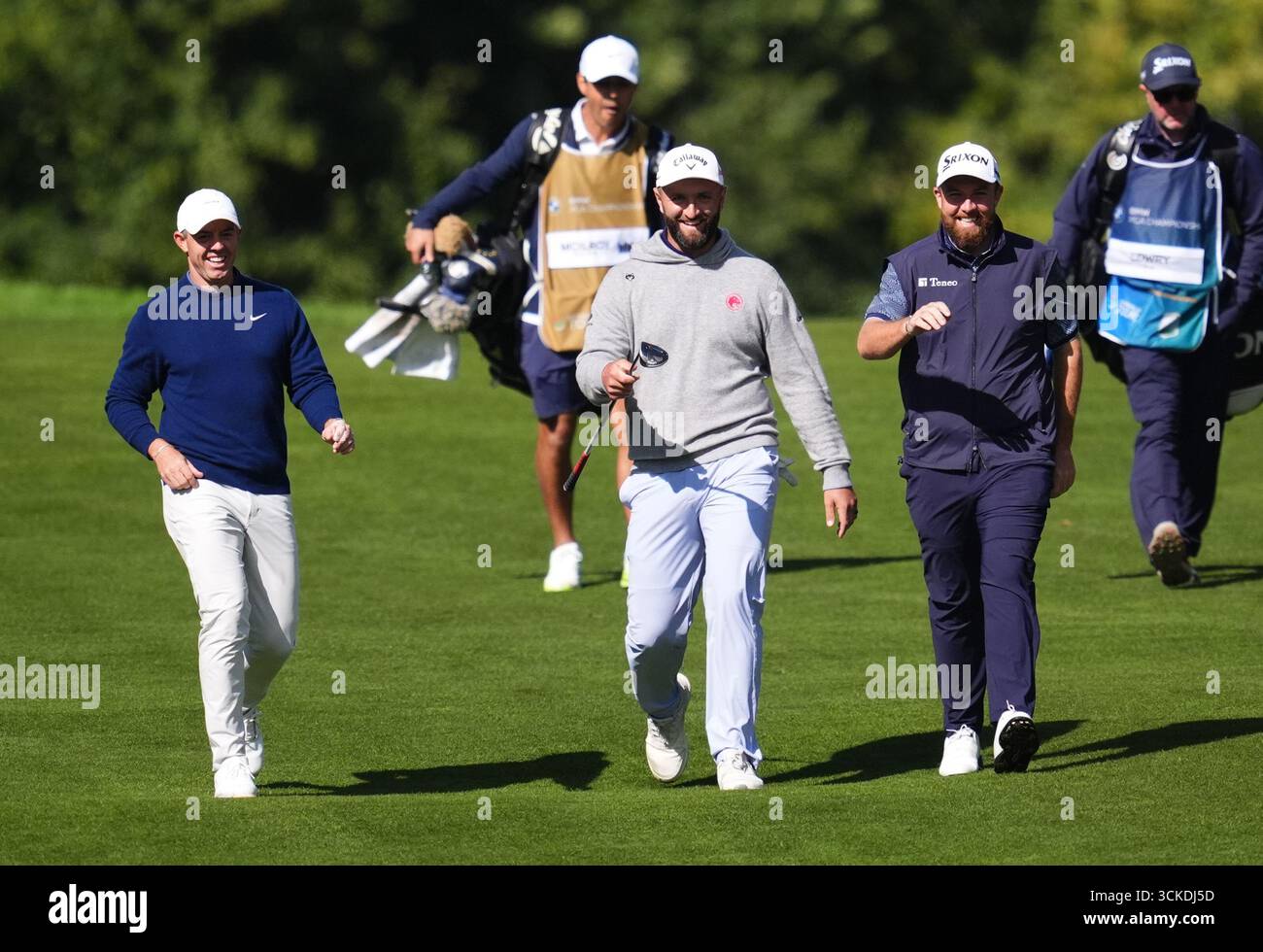 (left to right) Rory McIlroy, Jon Rahm and Shane Lowry walk the 4th ...
