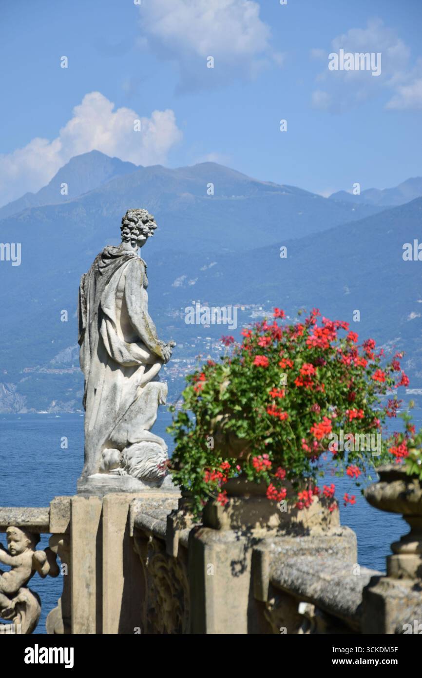 Statue overlooking Lake Como Stock Photo - Alamy