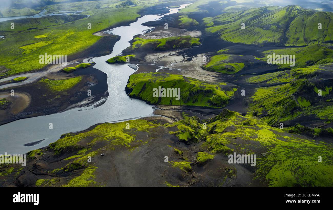 Aerial perspective of Iceland's volcanic terrain featuring moss covered ...