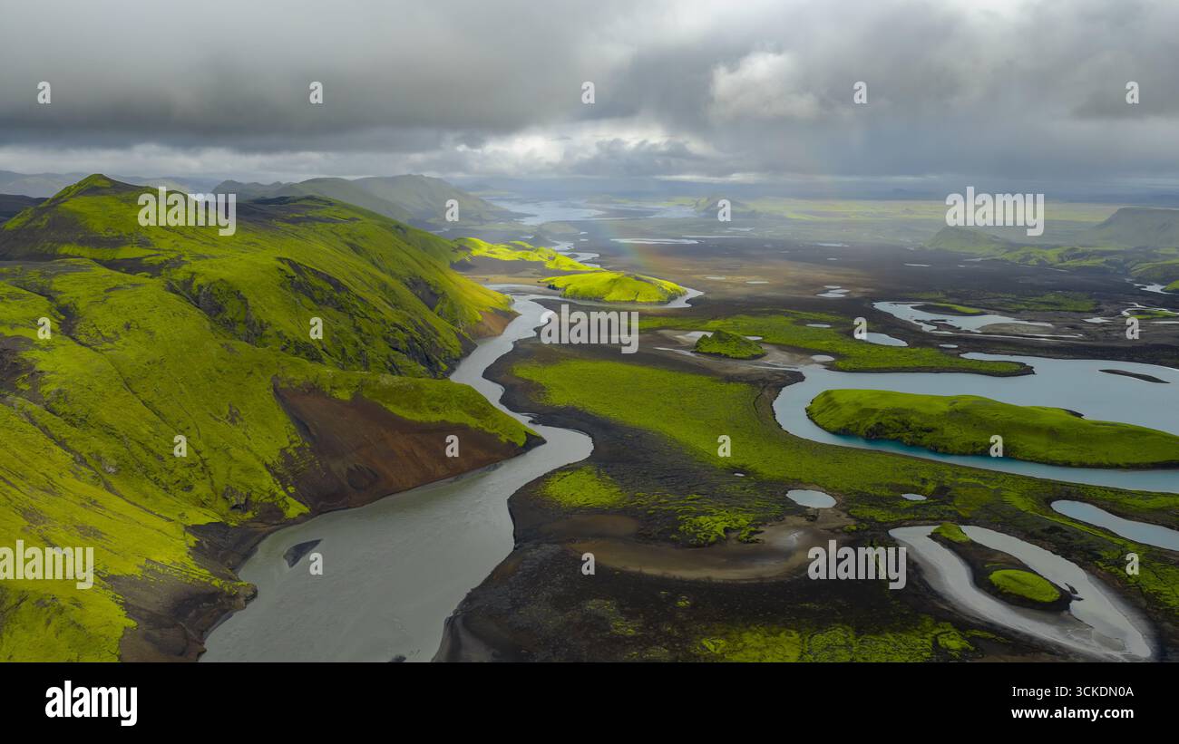 Aerial perspective of Iceland's volcanic terrain with green moss ...