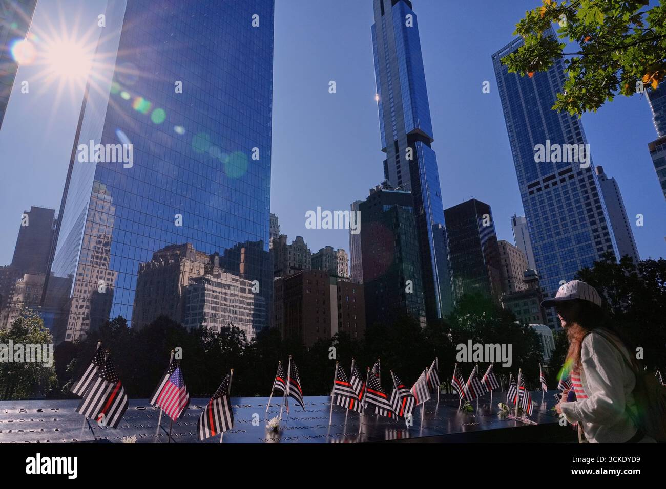 Mary Beth Delarm looks over the the names on the the 9/11 Memorial ...