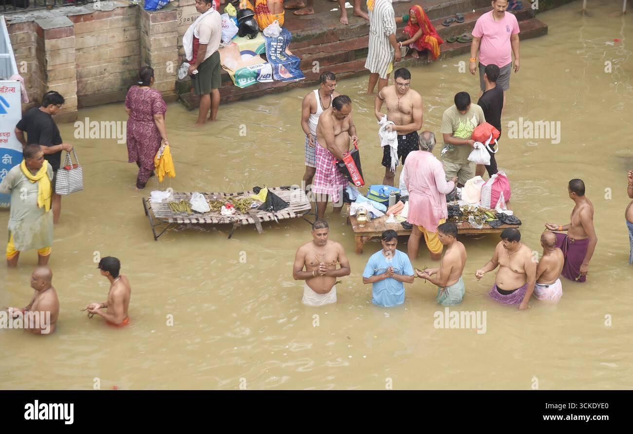 PATNA, INDIA - SEPTEMBER 9: People perform rituals to pay homage to ...