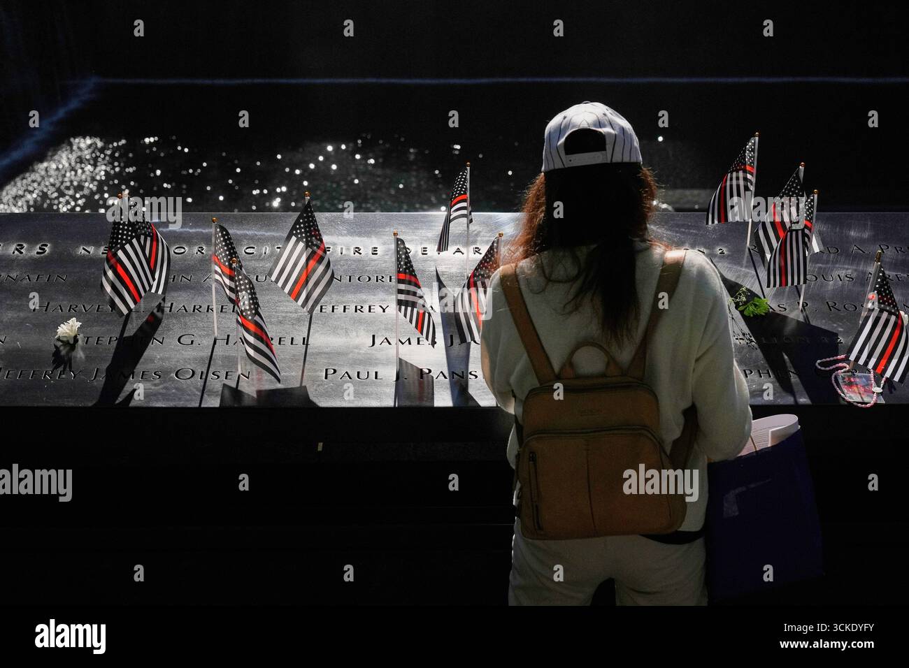 Mary Beth Delarm looks over the the names on the the 9/11 Memorial ...