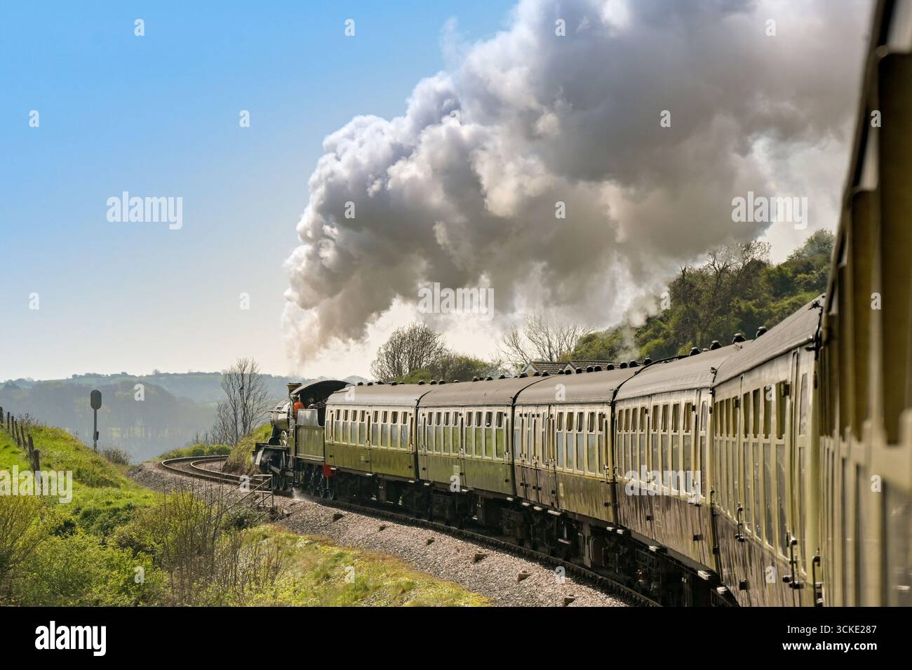 Paignton, Devon, England, UK - 24 April 2025: Steam engine pulling a ...
