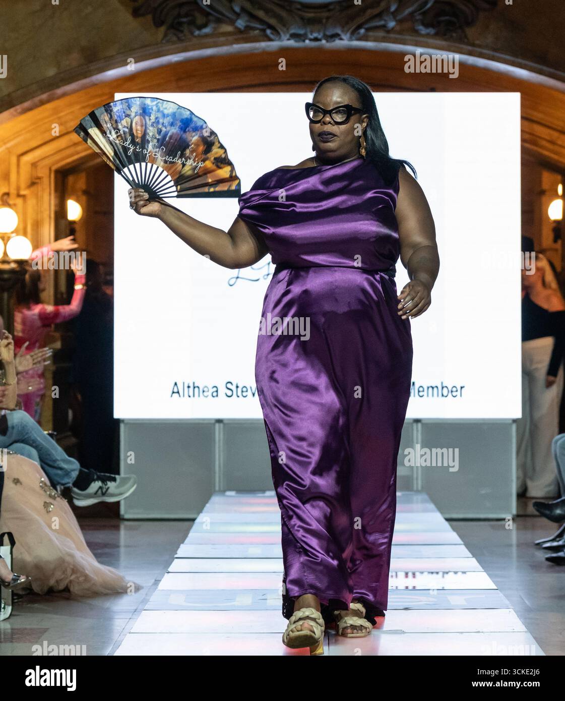 Althea Stevens, Council Member wearing dress by Lisne Bautista walks ...