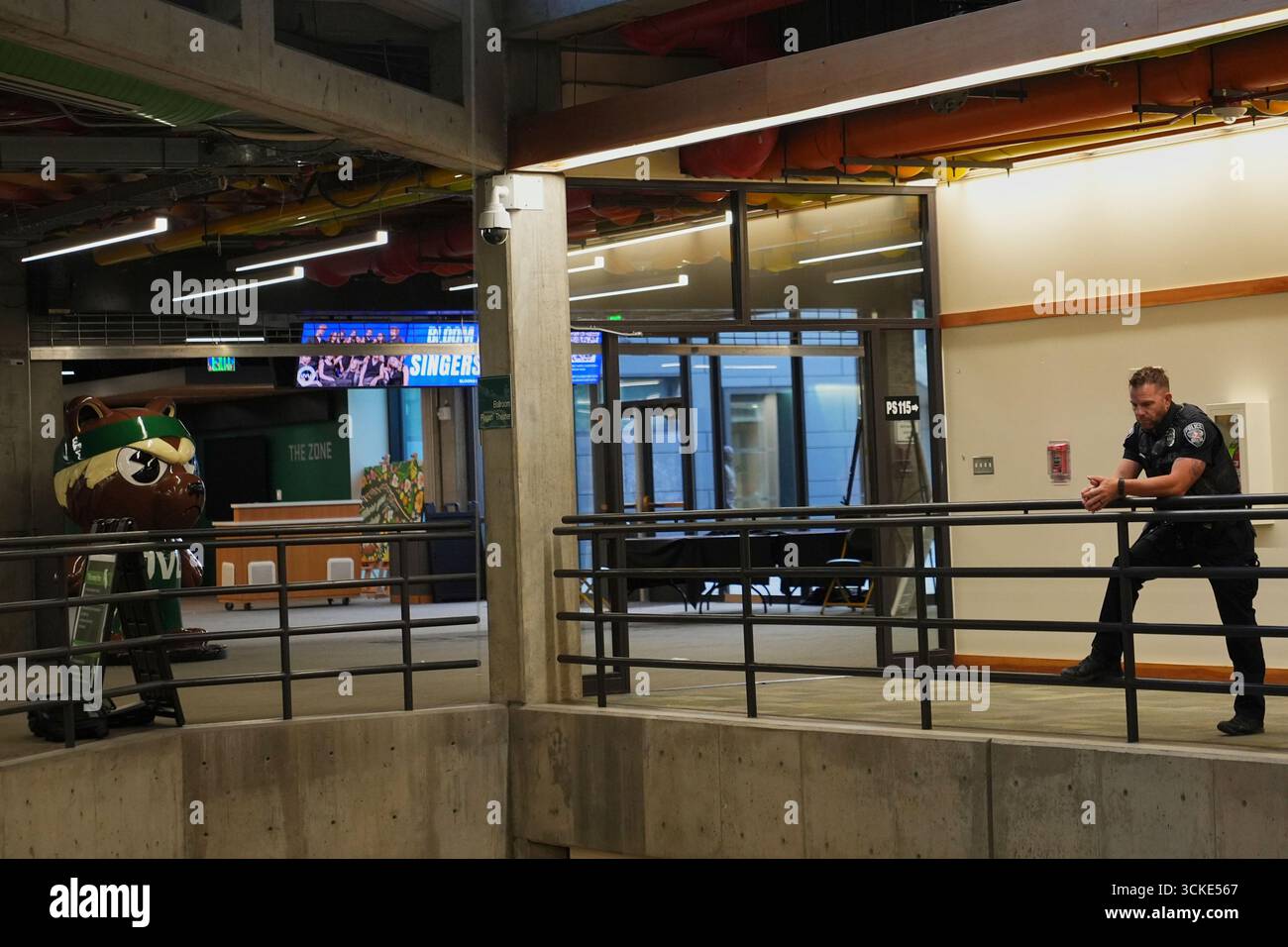 A police officer stands inside the Pope Science building a day after ...