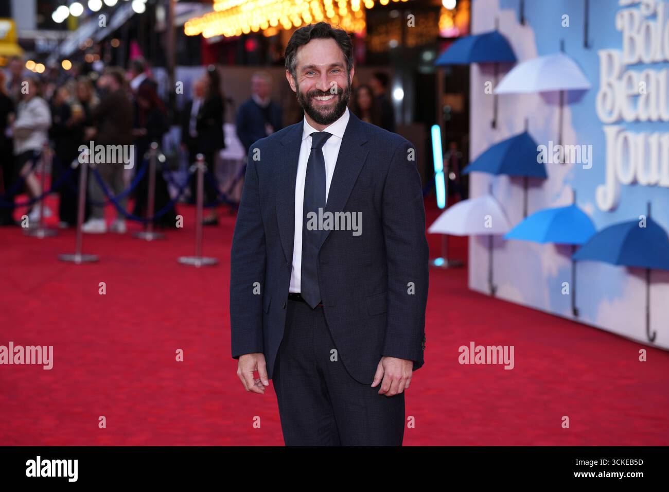 Writer Seth Reiss poses for photographers upon arrival at the premiere ...