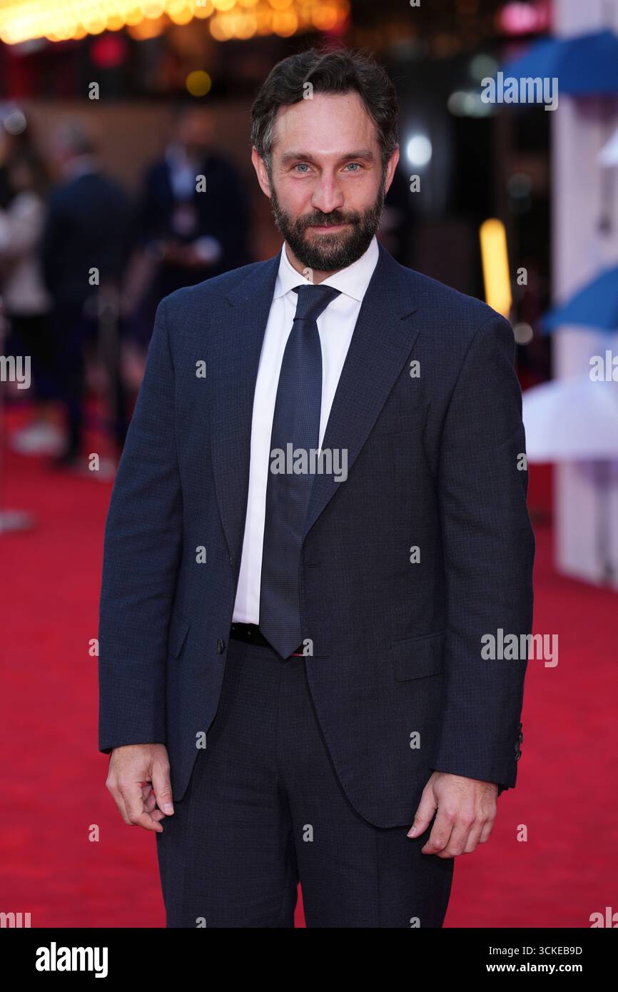 Writer Seth Reiss poses for photographers upon arrival at the premiere ...