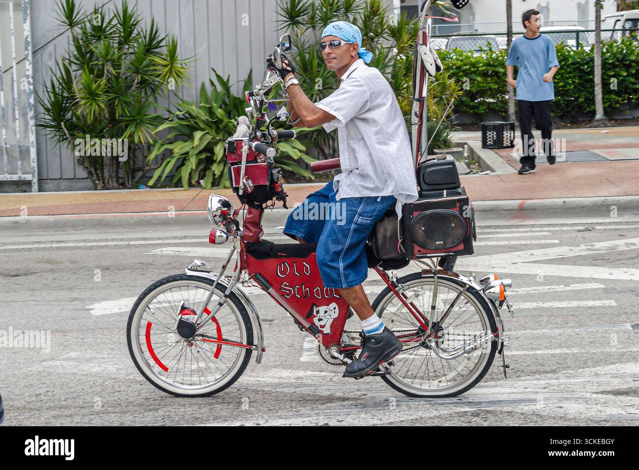 Hispanic man rides bike hi-res stock photography and images - Alamy