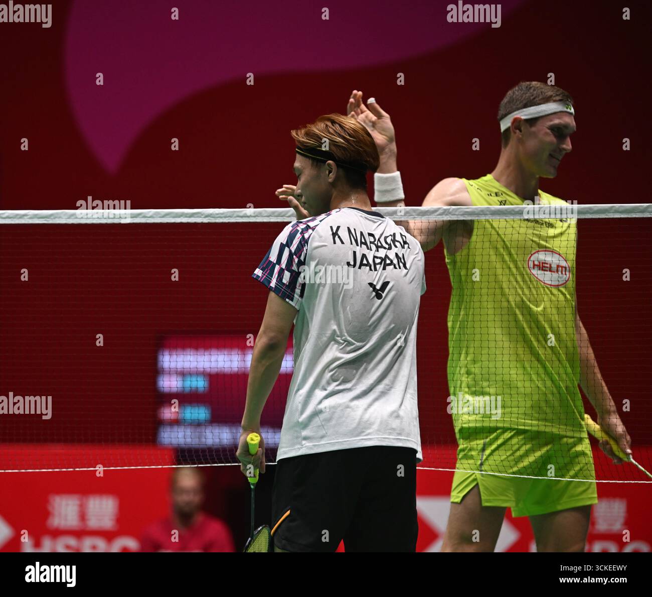 A Denmark badminton player Viktor Axelsen and a Japan badminton player ...