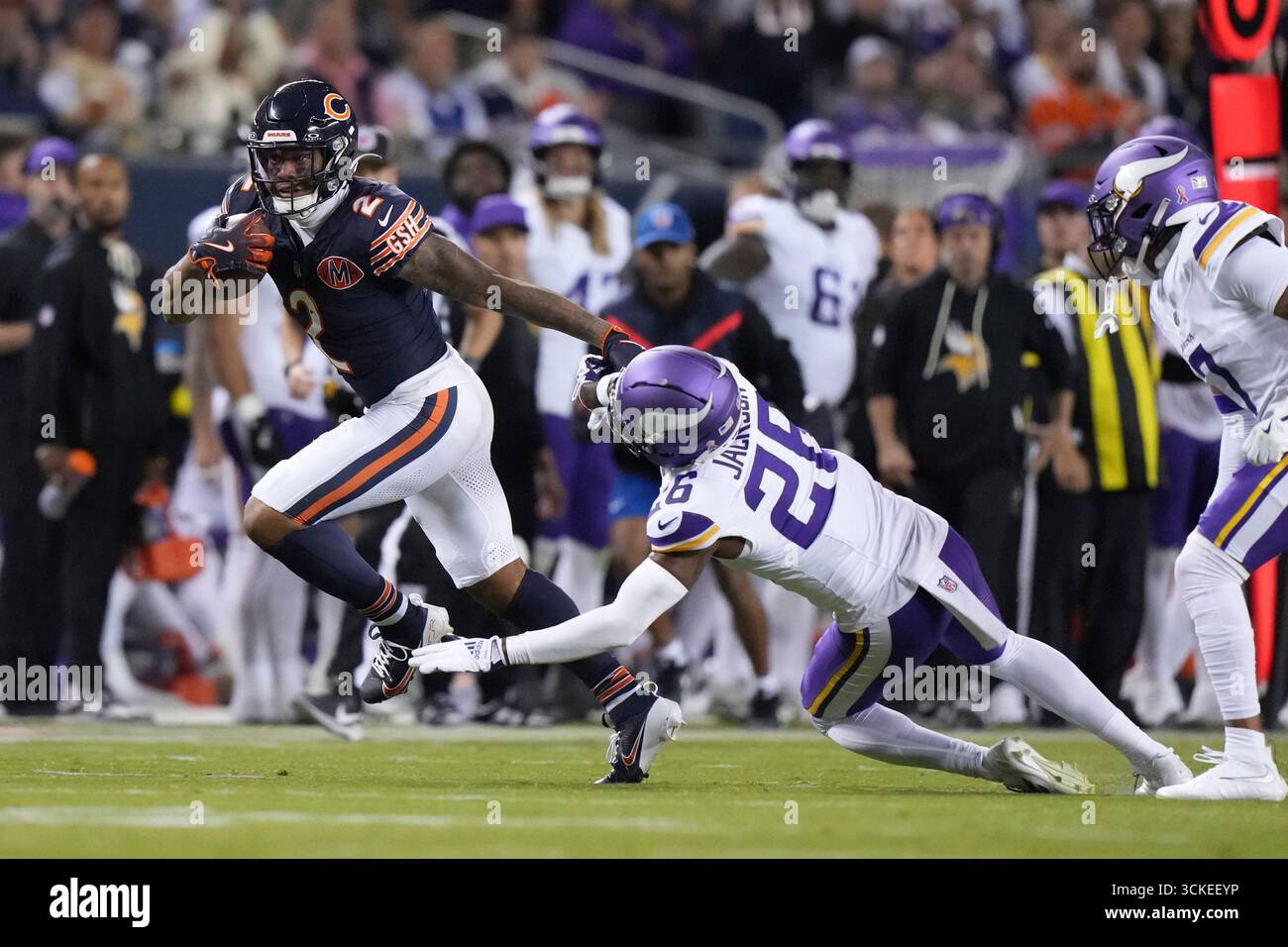 Chicago Bears wide receiver DJ Moore, left, runs past Minnesota Vikings ...